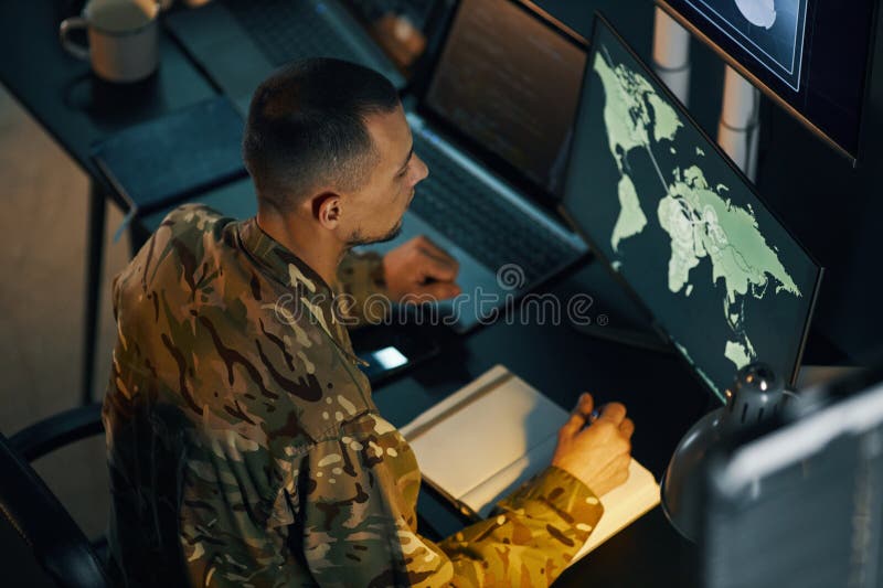 Analyzing Global Map on Multiple Computer Screens Stock Photo - Image ...