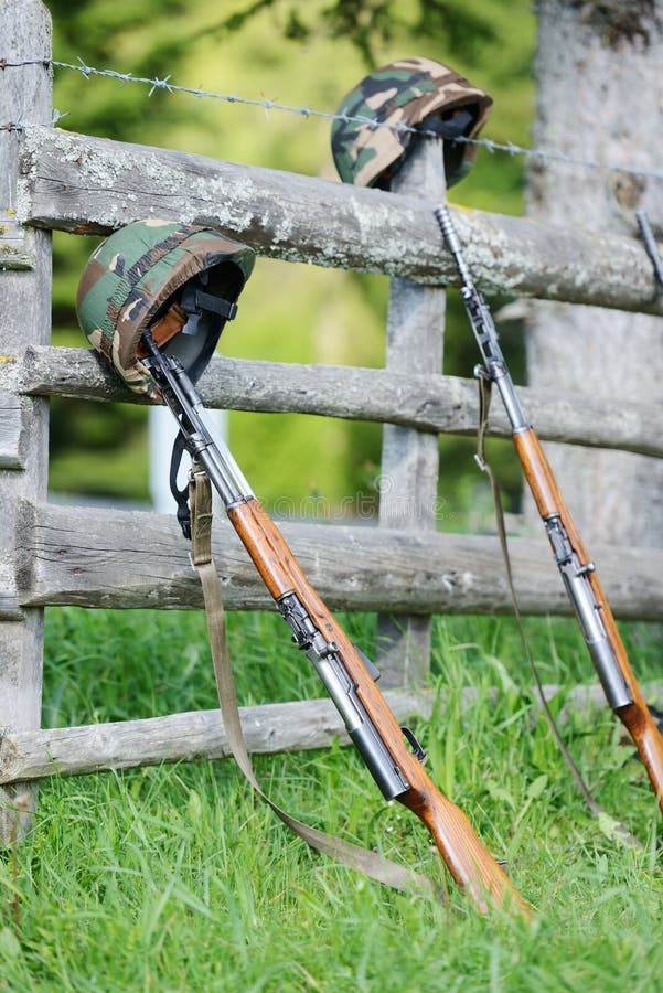 Military rifle and helmet stock photo. Image of real - 29128426