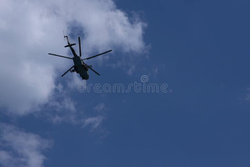 Military Russian Helicopter Flies in the Sky. Bottom View Stock Photo ...