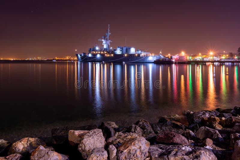 Military Ship with Night Lights and Reflection Stock Image - Image of ...