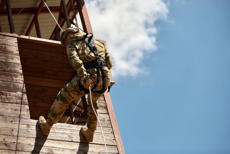 Military Soldier Climbing Net during Obstacle Course in Boot Camp Stock ...