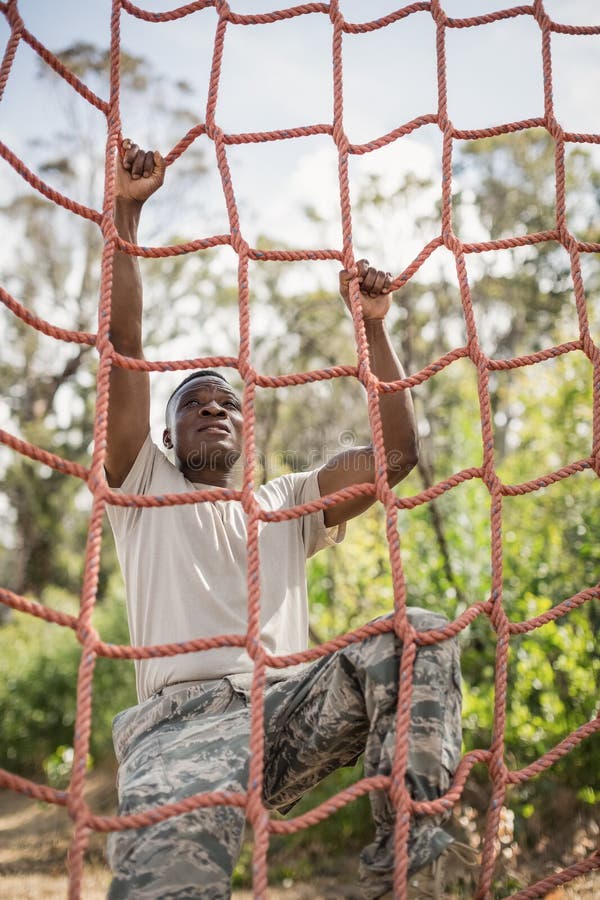 Military Soldier Climbing Net during Obstacle Course Stock Image ...