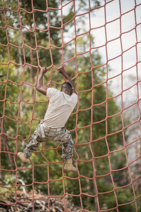 Military Soldier Climbing Net during Obstacle Course Stock Image ...