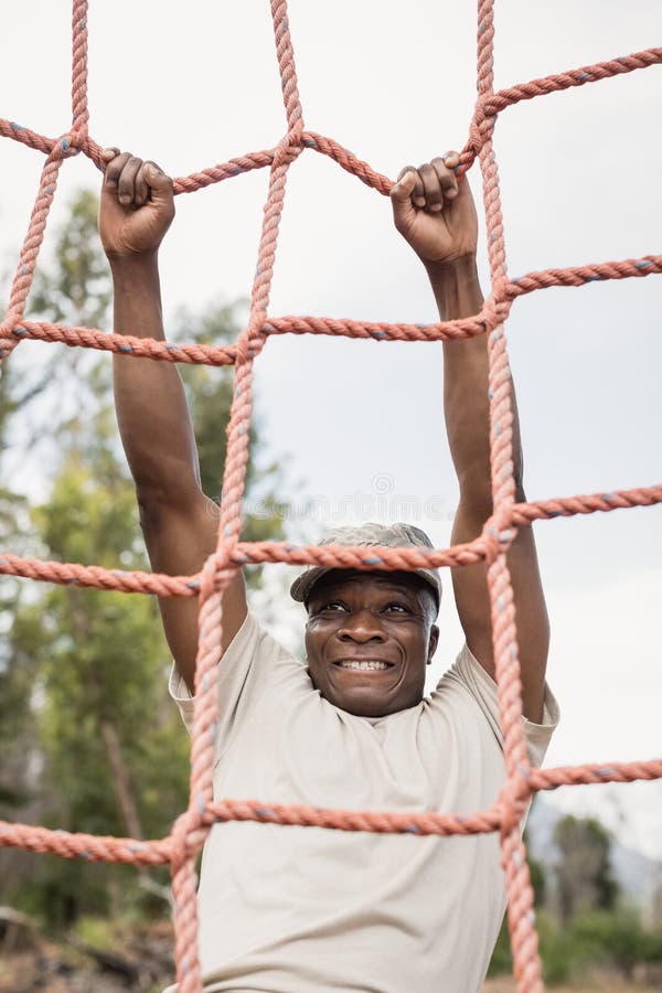 Military Soldier Climbing a Net during Obstacle Course Stock Image ...