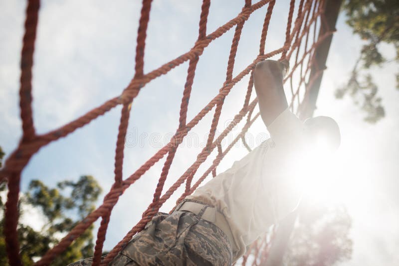 Military Soldier Climbing Rope during Obstacle Course Stock Photo ...