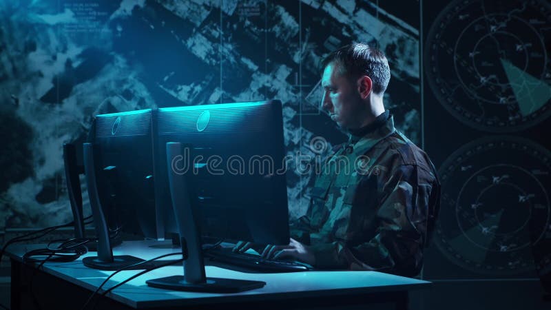 Military Soldier Operating Advanced Technology in a Command Center ...