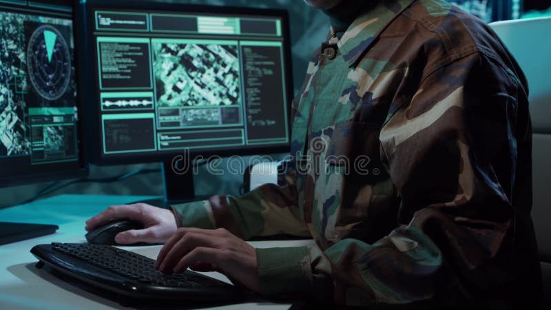 Military Soldier Operating Advanced Technology in a Command Center ...