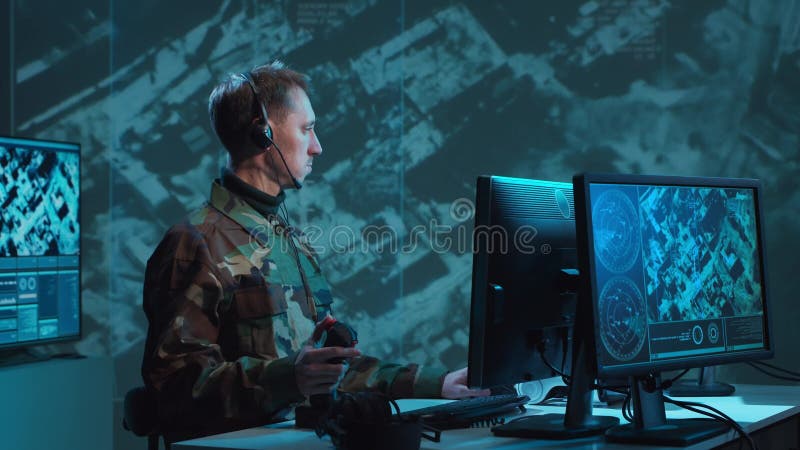 Military Soldier Operating Advanced Technology in a Command Center ...