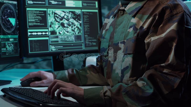 Military Soldier Operating Advanced Technology in a Command Center ...