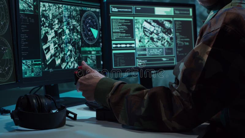 Military Soldier Operating Advanced Technology in a Command Center ...