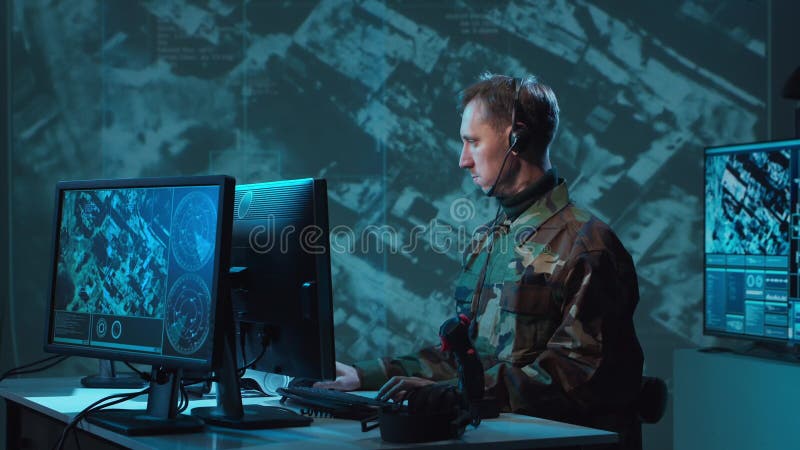 Military Soldier Operating Advanced Technology in a Command Center ...