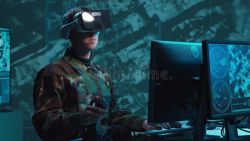 Military Soldier Operating Advanced Technology in a Command Center ...