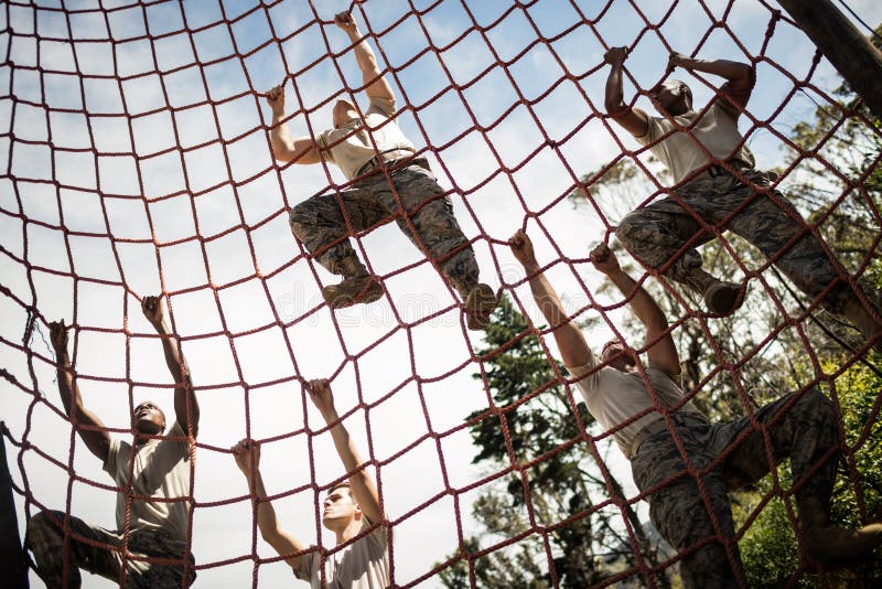 Military Soldiers Climbing Rope during Obstacle Course Stock Image ...
