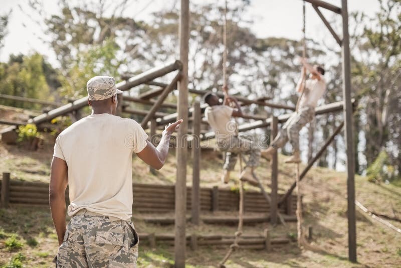 Military Man Standing with Arms Crossed during Obstacle Course in Boot ...