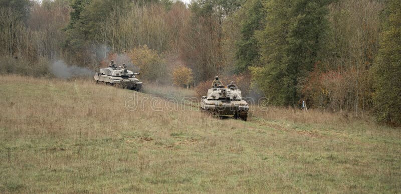 Military Tanks Moving in a Field Stock Photo - Image of battle, armored ...