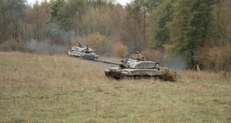 Military Tanks Moving in a Field Stock Photo - Image of equipment ...