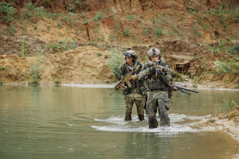 Military Team Crossing the River Under Fire Stock Photo - Image of ...