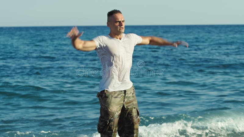 Soldier Does Aerobic Exercises on the Seashore Stock Footage - Video of ...
