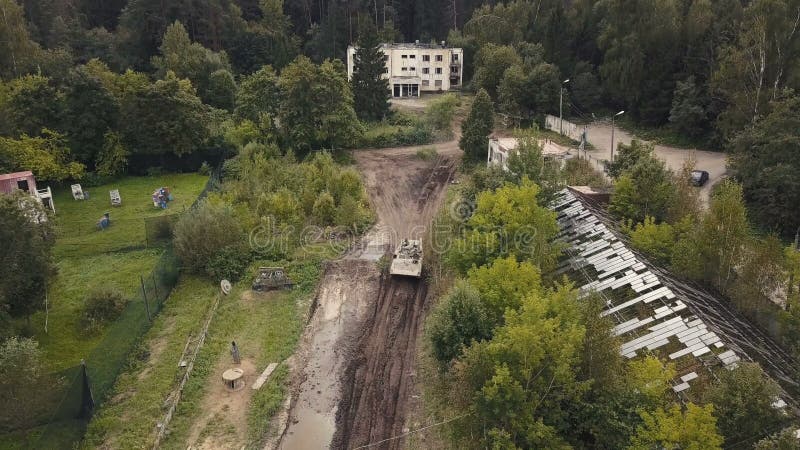 Military Vehicle during Training Driving on Shooting Range View from ...