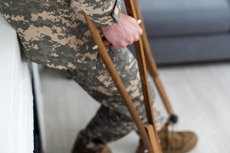 Military Wounded Soldier Using Crutch Stock Photo - Image of combat ...