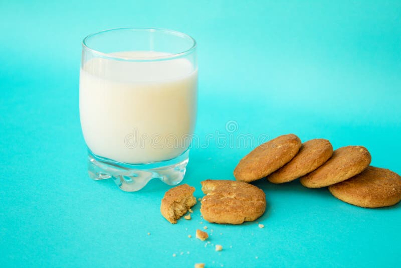 Milk and Biscuit on Blue Background. Stock Image - Image of closeup ...