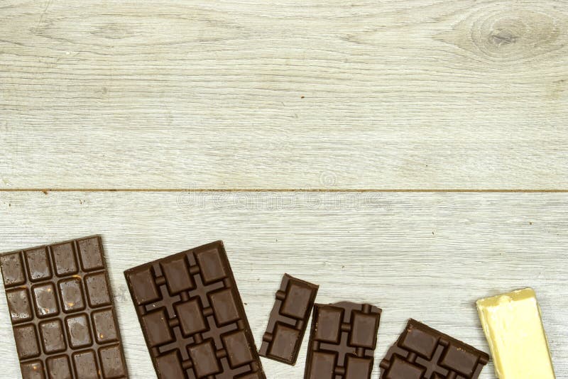 Milk and Black, White Chocolate Bars on Wood Table.milk and Black ...