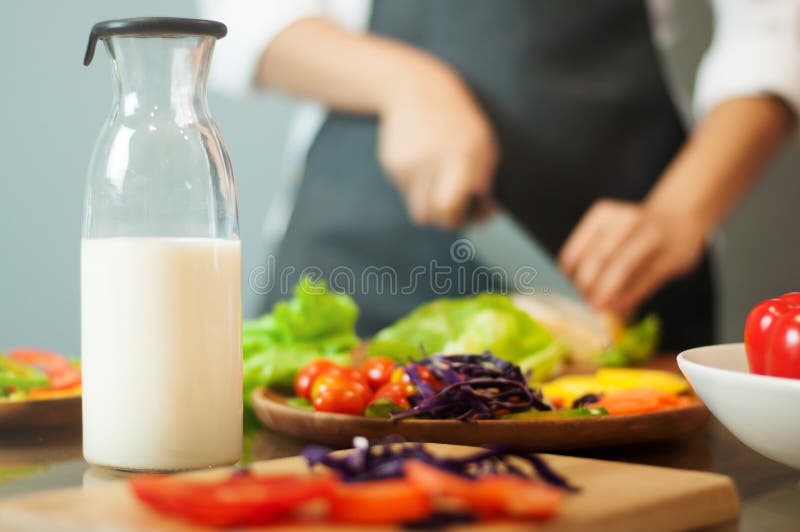 Milk in Bottle with Woman Cooking Stock Photo - Image of female ...