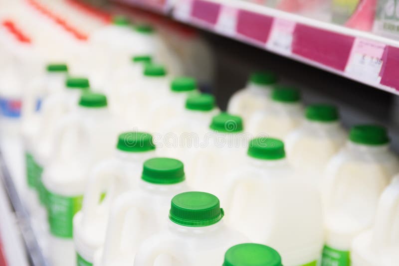 Milk Bottles Tidied in Shelf Stock Photo - Image of retail, consumerism ...