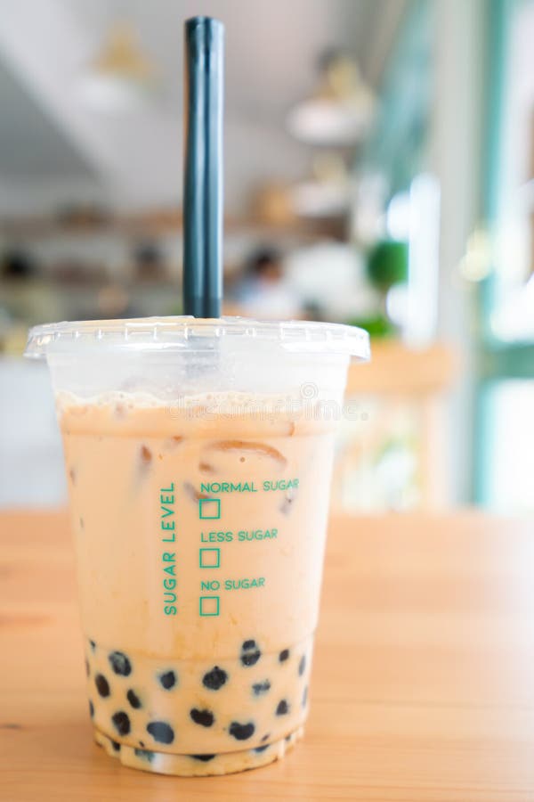 Milk Bubble Tea with Tapioca Pearls on Wooden Table Stock Photo - Image ...