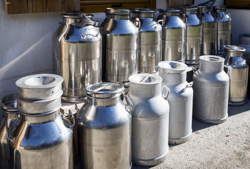 Old milk canisters stock image. Image of retro, objects - 37480295