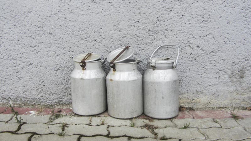 Milk cans on a dairy farm stock image. Image of subsidies - 184708437