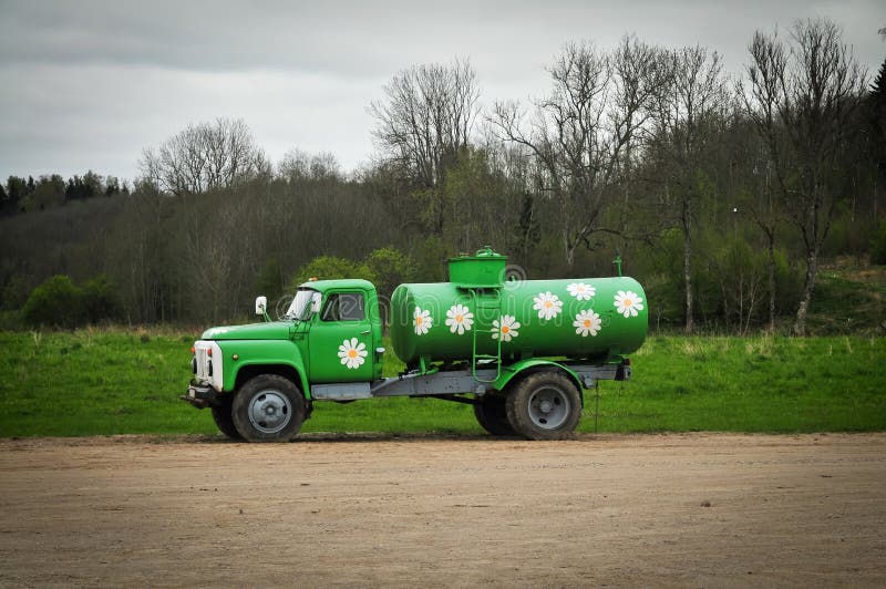 Milk Car Drawn with Daisies Stock Photo - Image of automobile, green ...