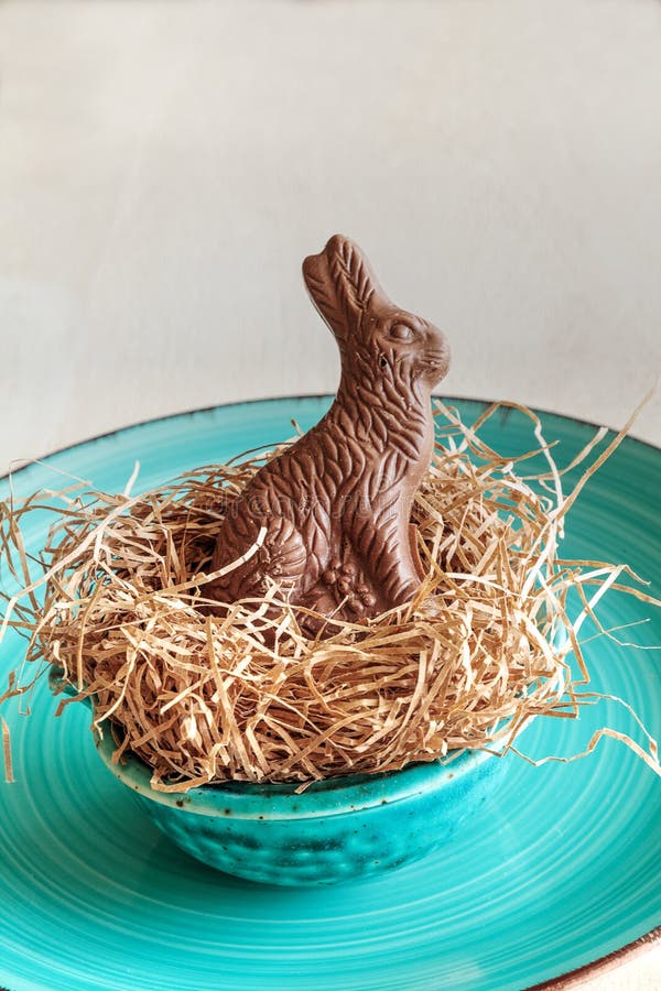 Milk Chocolate Easter Bunny in an Easter Basket Stock Photo - Image of ...