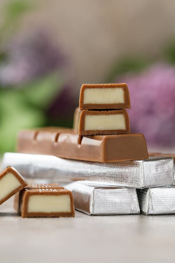 Milk Chocolate with Milk Filling on White Background. Stack of Milk ...