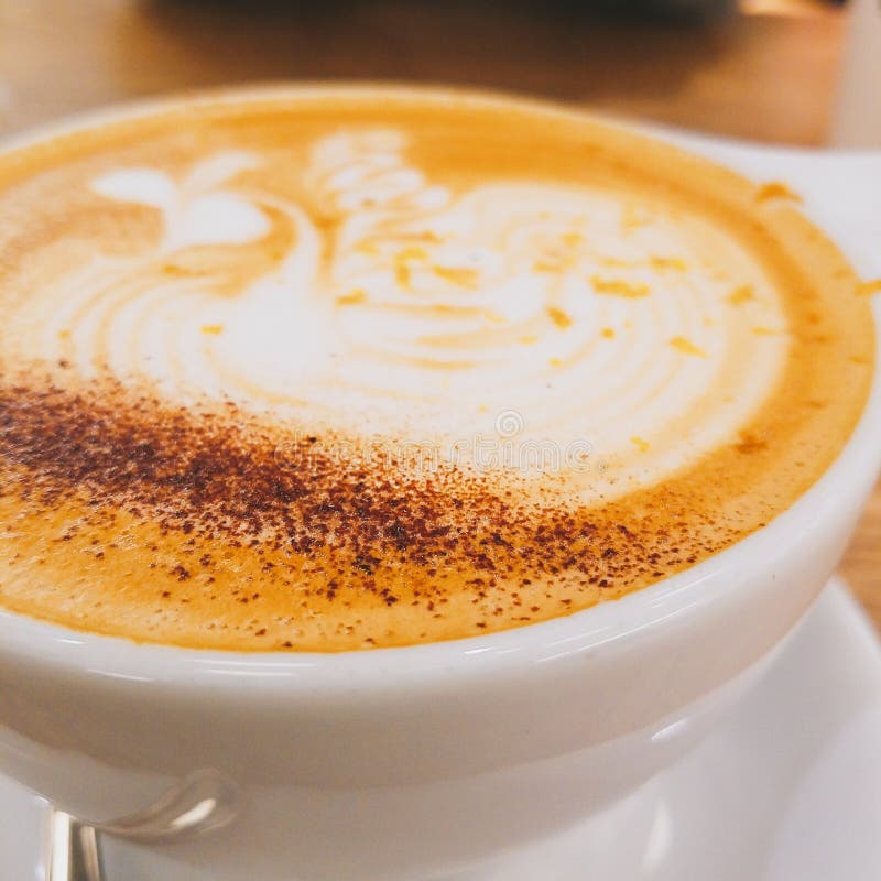 Milk Coffee with Chocolate Powder in a Cup Stock Image - Image of ...