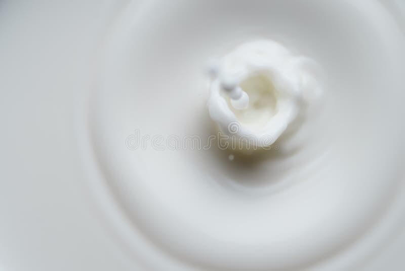 Milk or cream drop falls stock image. Image of macro - 206756405