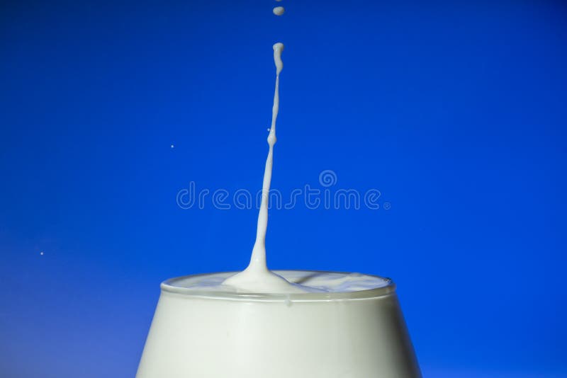 Milk drop splash falling stock photo. Image of drink - 207581636