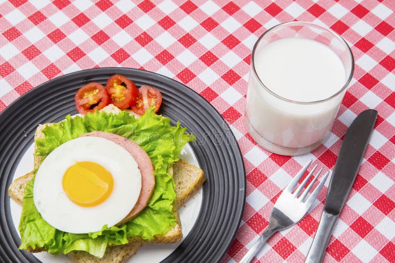 Milk with Egg Sandwich on the Dining Table Stock Photo - Image of pile ...