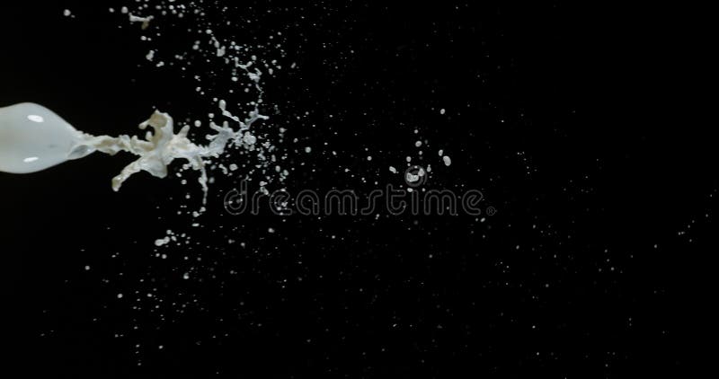 Milk Exploding and Splashing on Black Background, Slow Motion Stock ...
