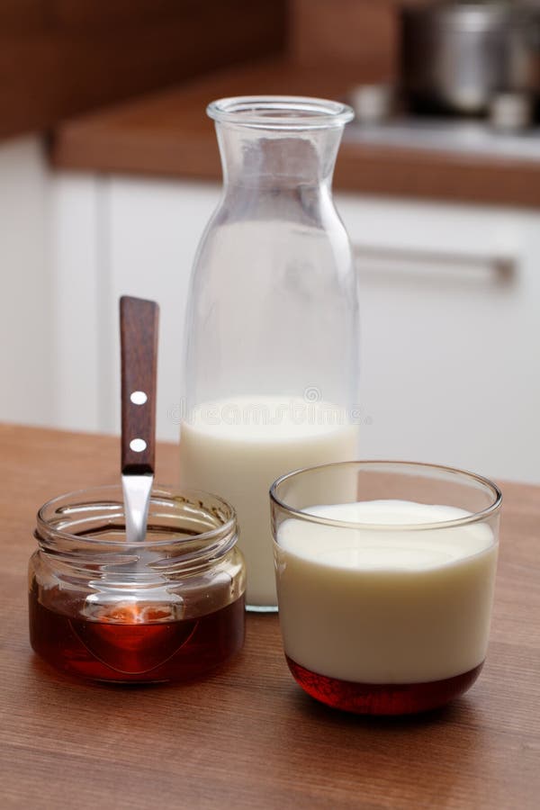 Milk with honey stock image. Image of kitchen, portion - 71430375