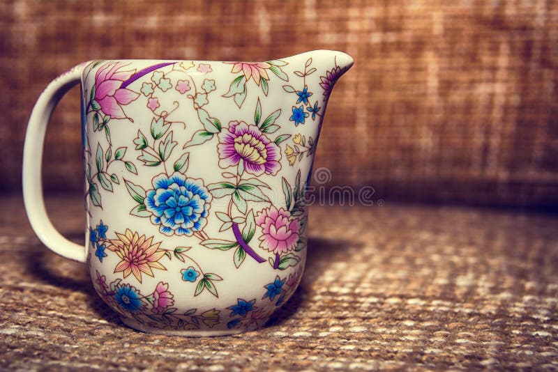 Milk jug on the fabric stock photo. Image of design, travel - 84422844
