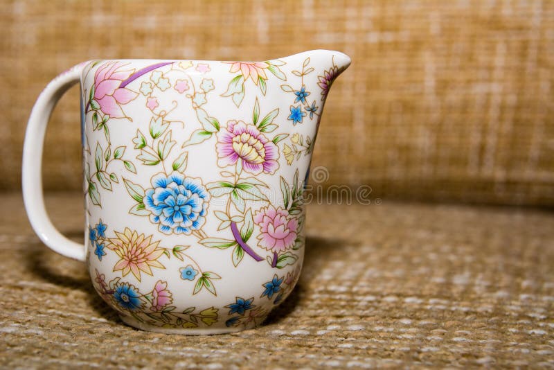 Milk jug on the fabric stock photo. Image of vivid, closeup - 84429268