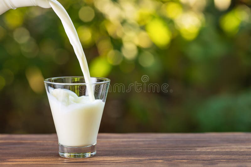 Milk from Jug Pouring into Glass Stock Image - Image of stream, nature ...