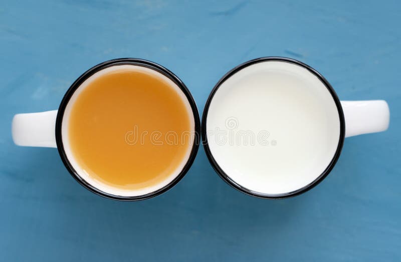 Milk and Orange Juice in the Pretty Small Cups Stock Image - Image of ...