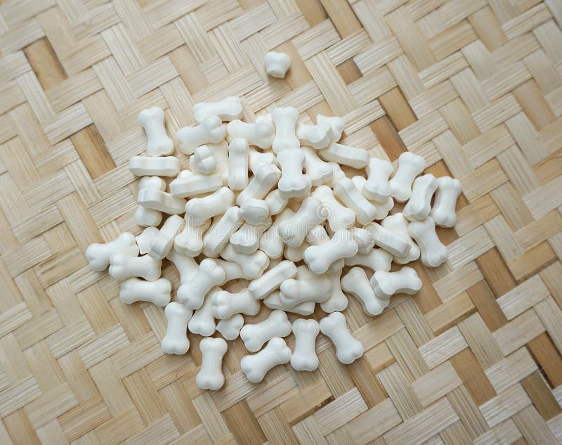 Milk pellets in bone shape stock image. Image of pellets - 61785209