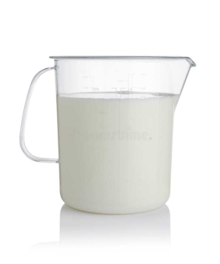 Milk in a Plastic Measuring Cup Isolated Stock Photo - Image of ...