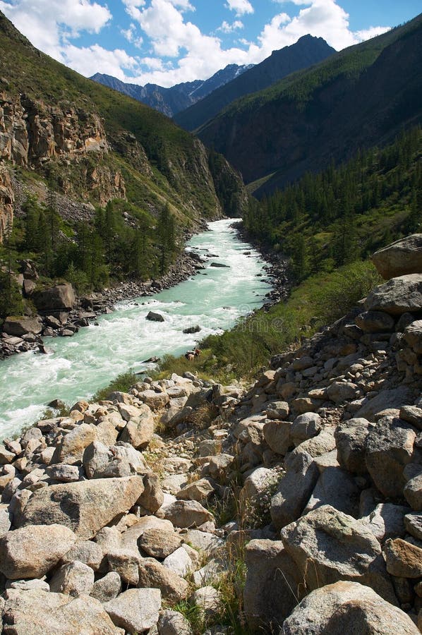 Milk River in the Mountains Stock Image - Image of clouds, grass: 502629