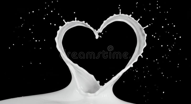 Milk Splash Heart Shape Against Black Background in High-speed Capture ...