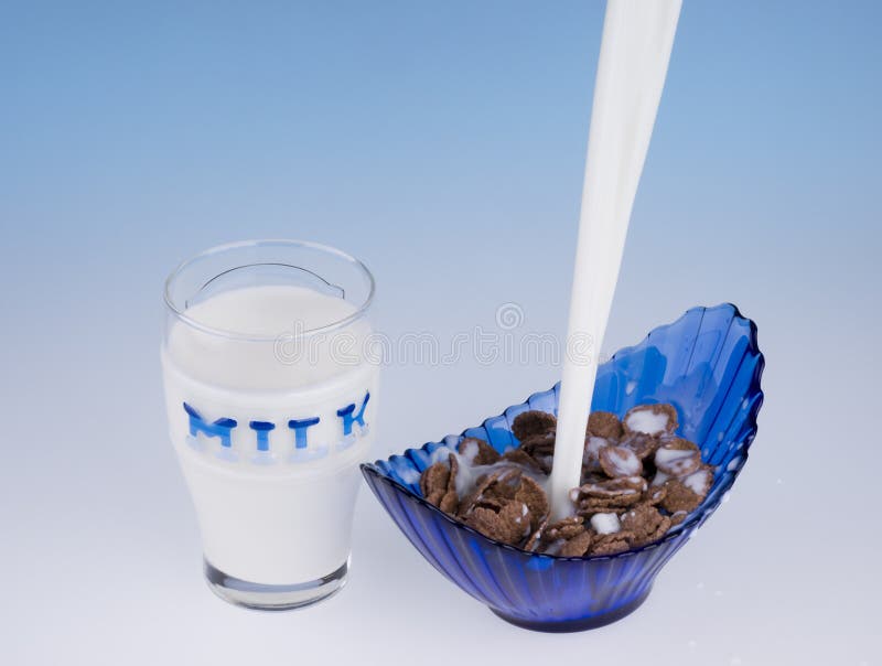 Milk Stream Pouring into Chocolate Flakes. Stock Image - Image of ...