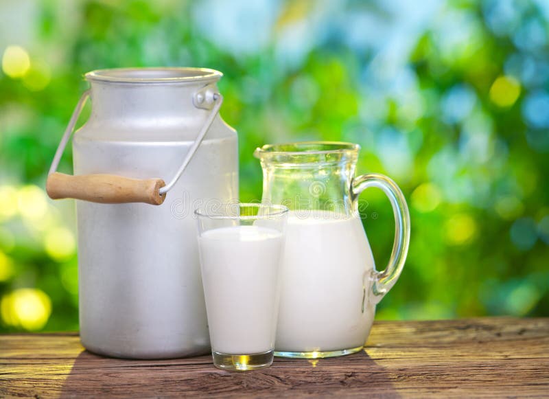 Milk in various dishes. stock image. Image of vintage - 37846769